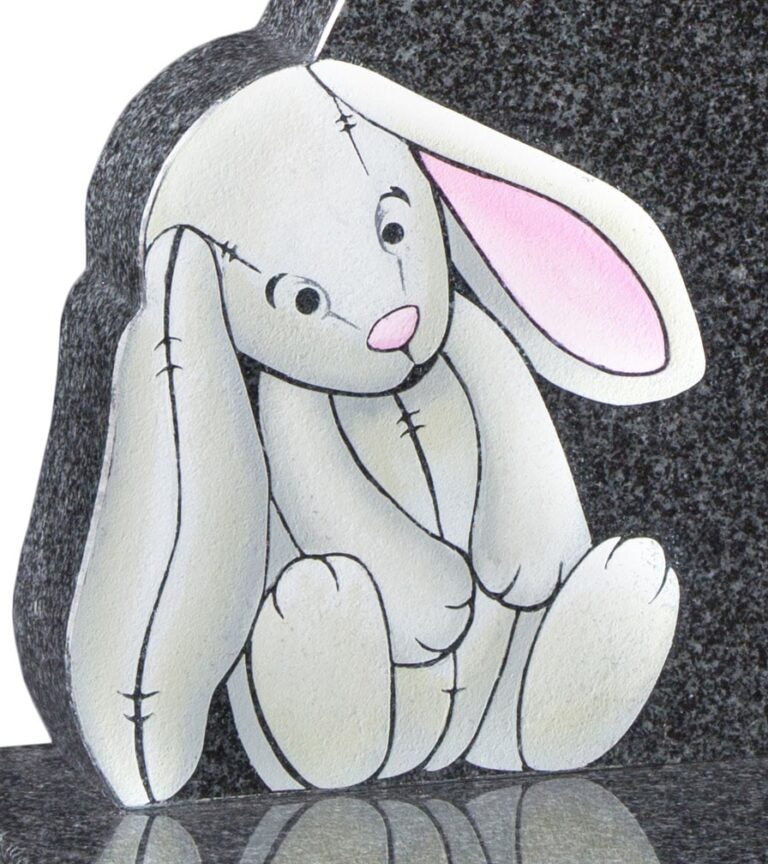 This circular rabbit headstone is further shaped around the sandblasted ...